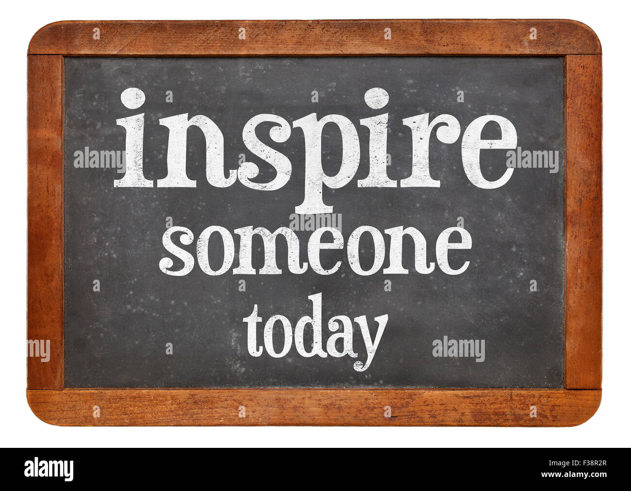 Inspire someone today - motivational phrase on a vintage slate ...