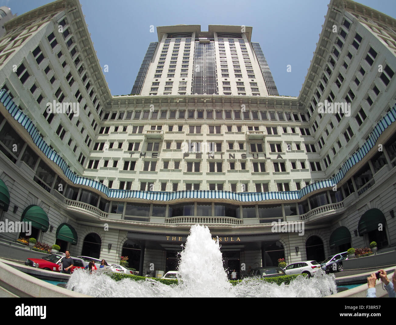 A wide angle view looking up at the front entrance and facade of the ...