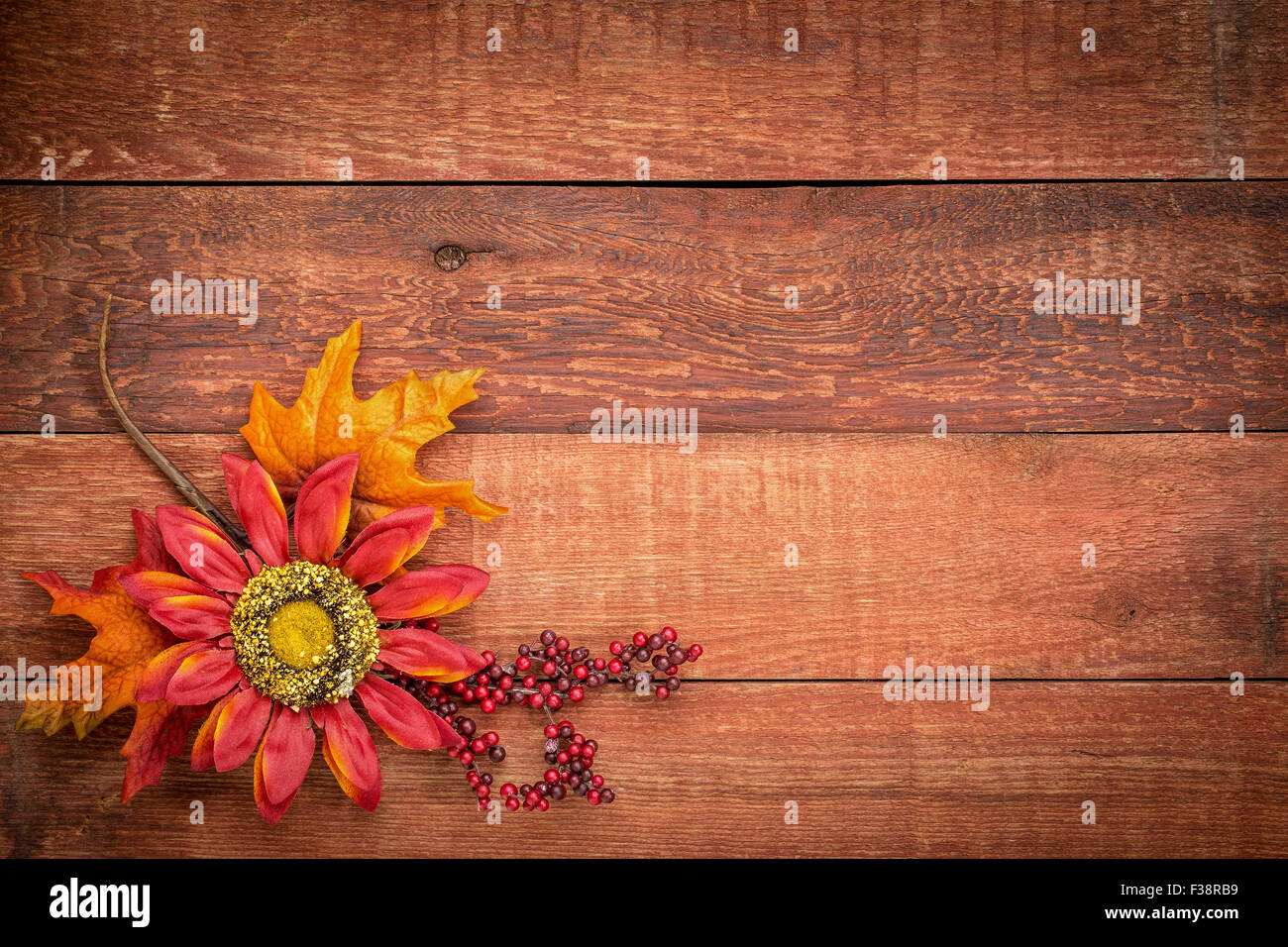 grunge red barn wood background with colorful fall decoration Stock ...