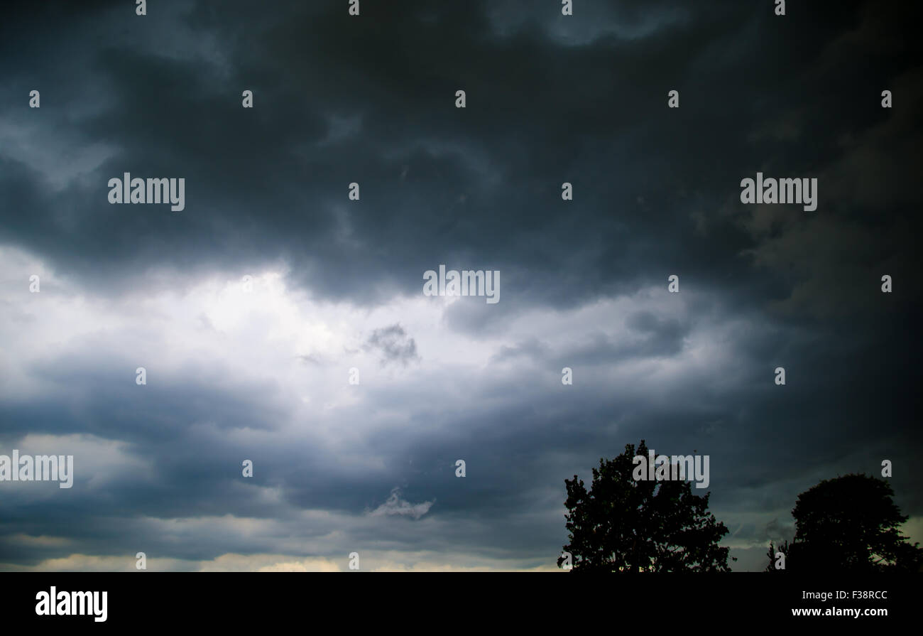 big storm cloud over the tree Stock Photo - Alamy