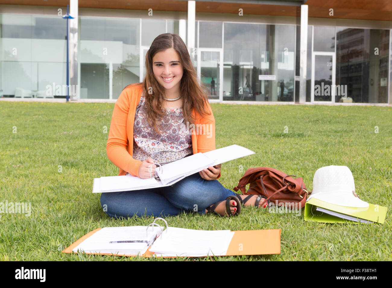 Young woman studying at the university campus Stock Photo - Alamy