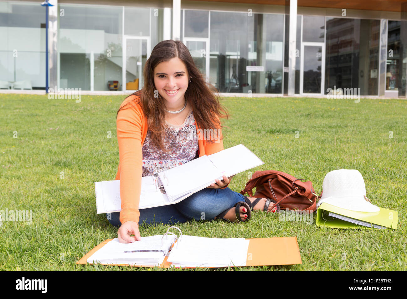 Young woman studying at the university campus Stock Photo - Alamy