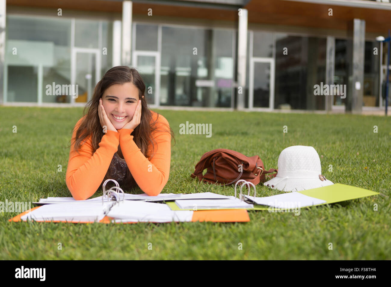 Young woman studying at the university campus Stock Photo - Alamy