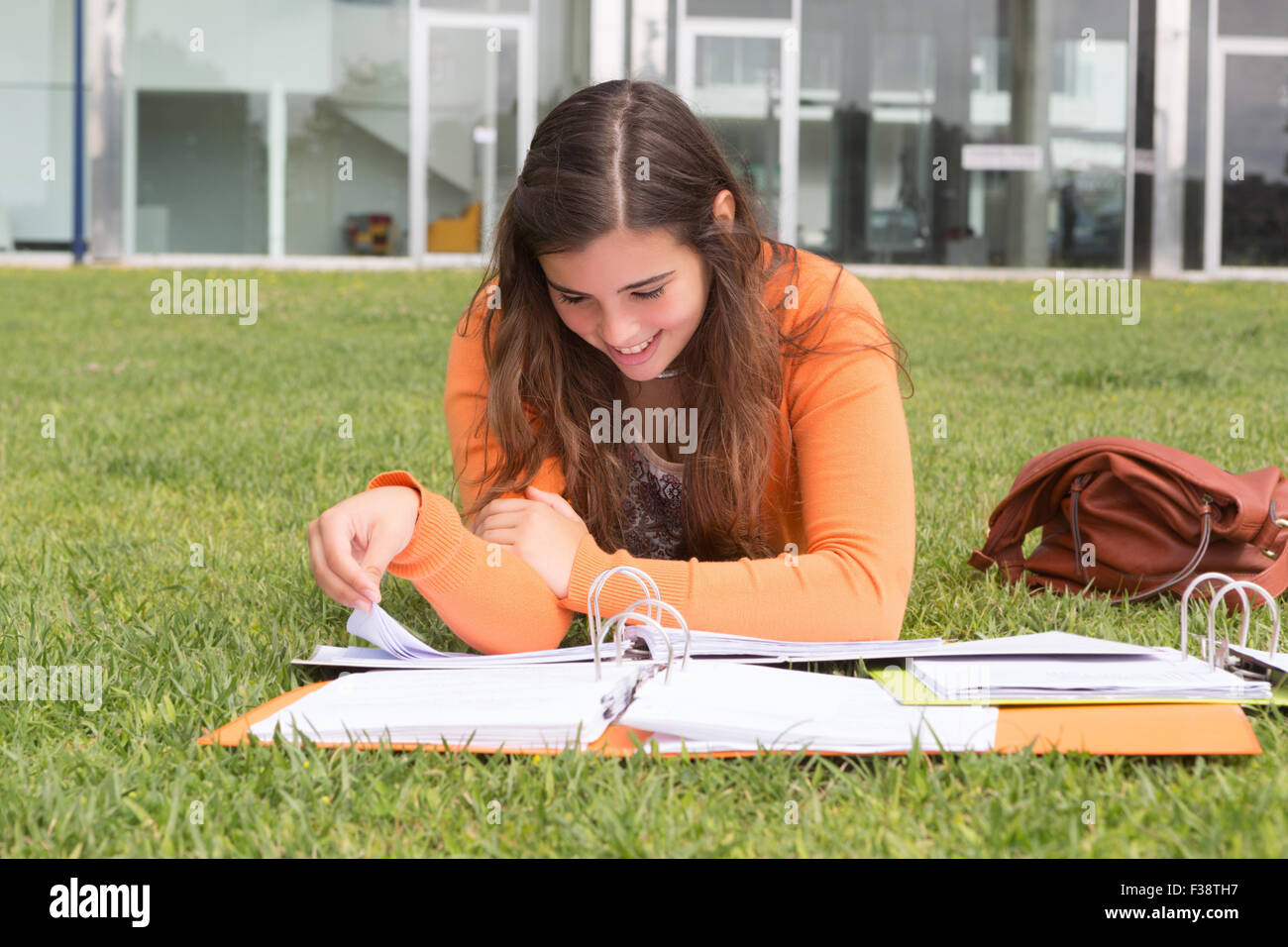 Young woman studying at the university campus Stock Photo - Alamy