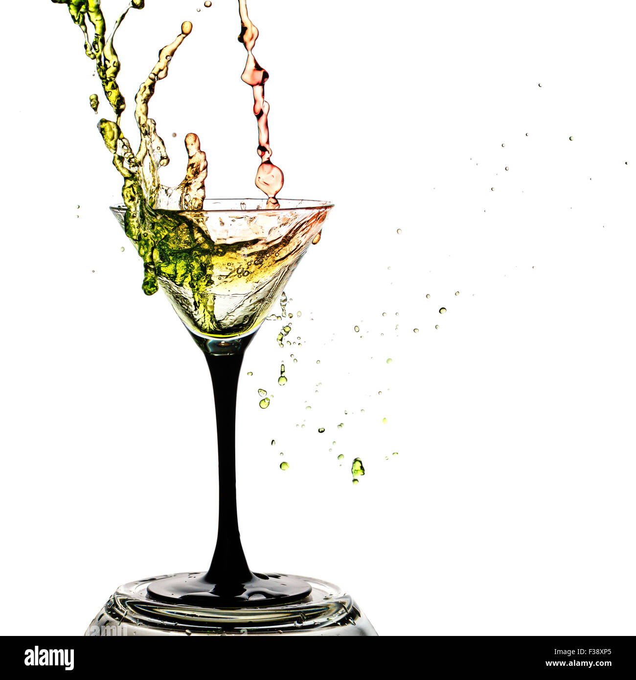 Abstract art. Cocktail glass with splashes of liquid isolated on a ...