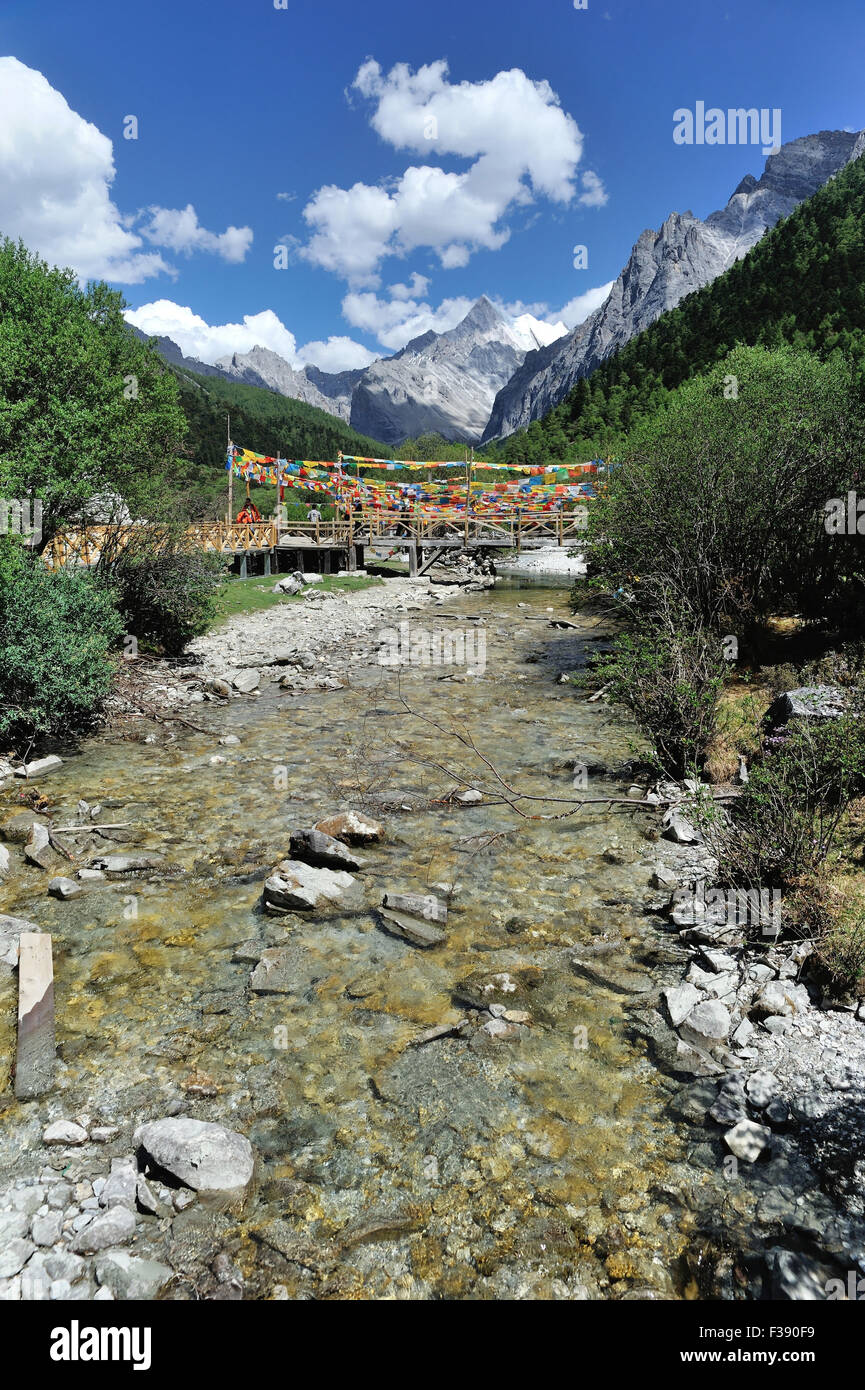 Tibet snow mountain with river in China Stock Photo - Alamy
