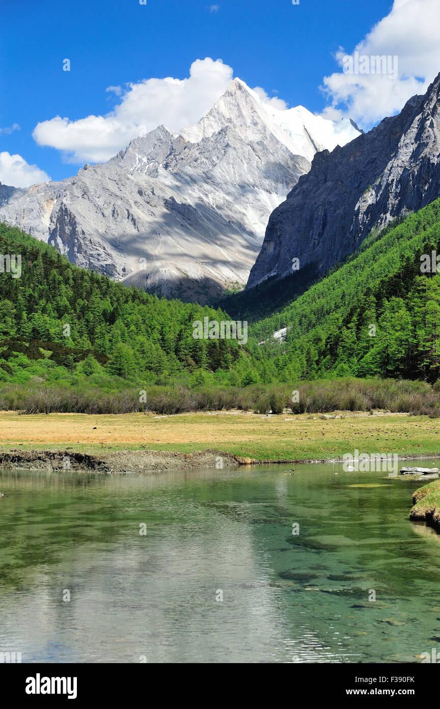 Tibet snow mountain with river in China Stock Photo - Alamy