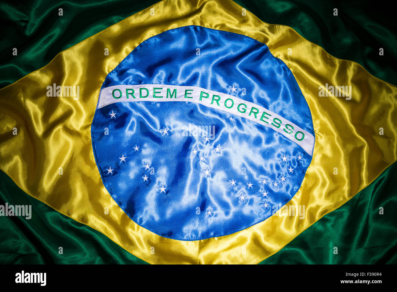 Brazilian flag in silky fabric shining in textured silky background ...