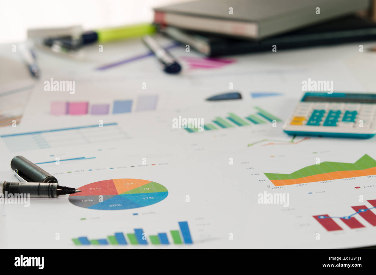 Financial paper charts and graphs on the table Stock Photo - Alamy