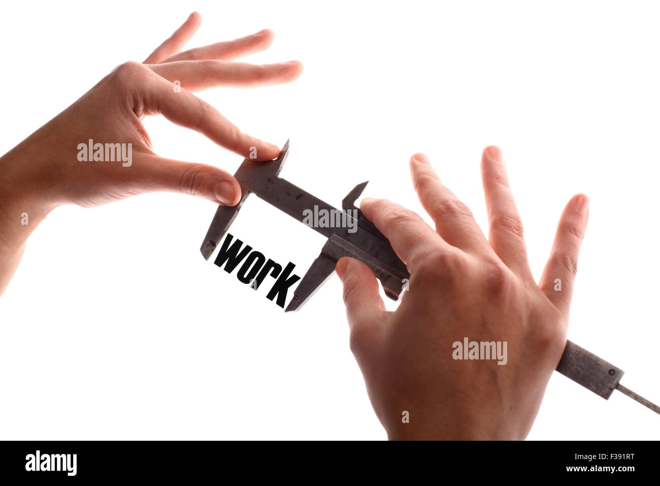Color horizontal shot of two hands holding a caliper and measuring the ...