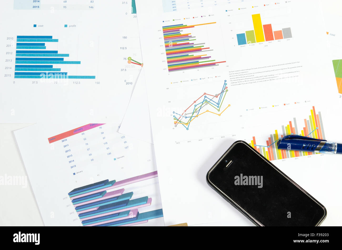 Financial paper charts and graphs on the table Stock Photo - Alamy