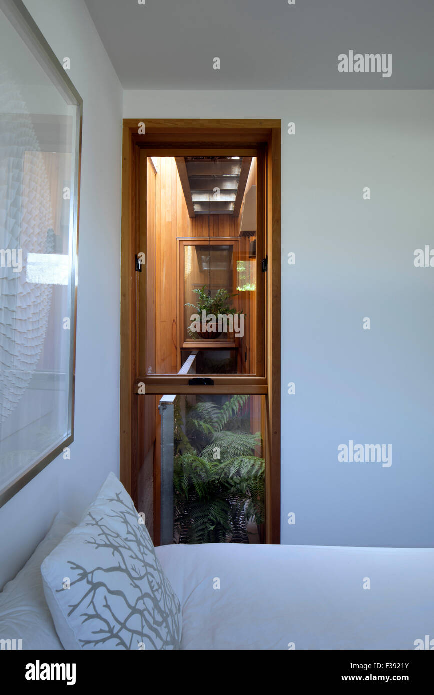 Bedroom window allows light from and view to skylight void ...