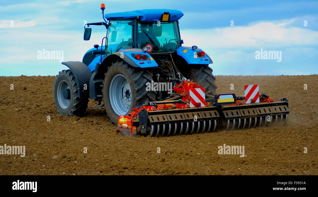 Agricultural Landscape - Tractor working on the field - summer sunny ...