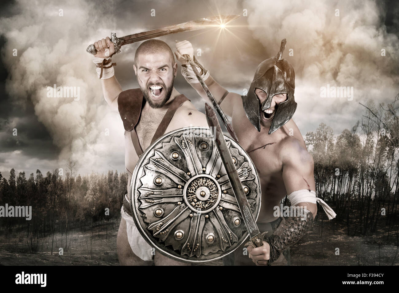 Ancient warriors in a battle in the forest Stock Photo - Alamy