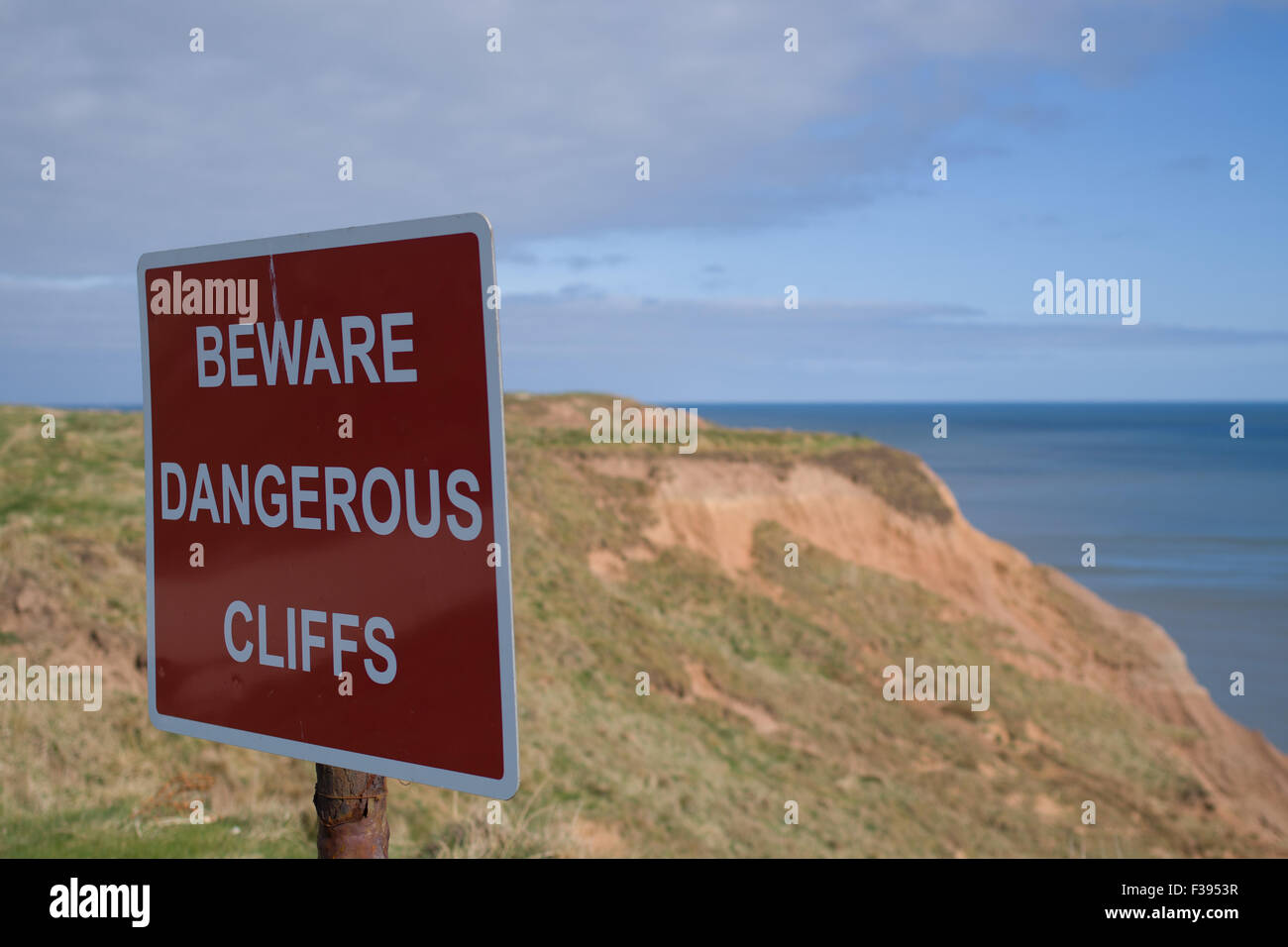 Warning sign Beware Dangerous Cliffs Stock Photo - Alamy