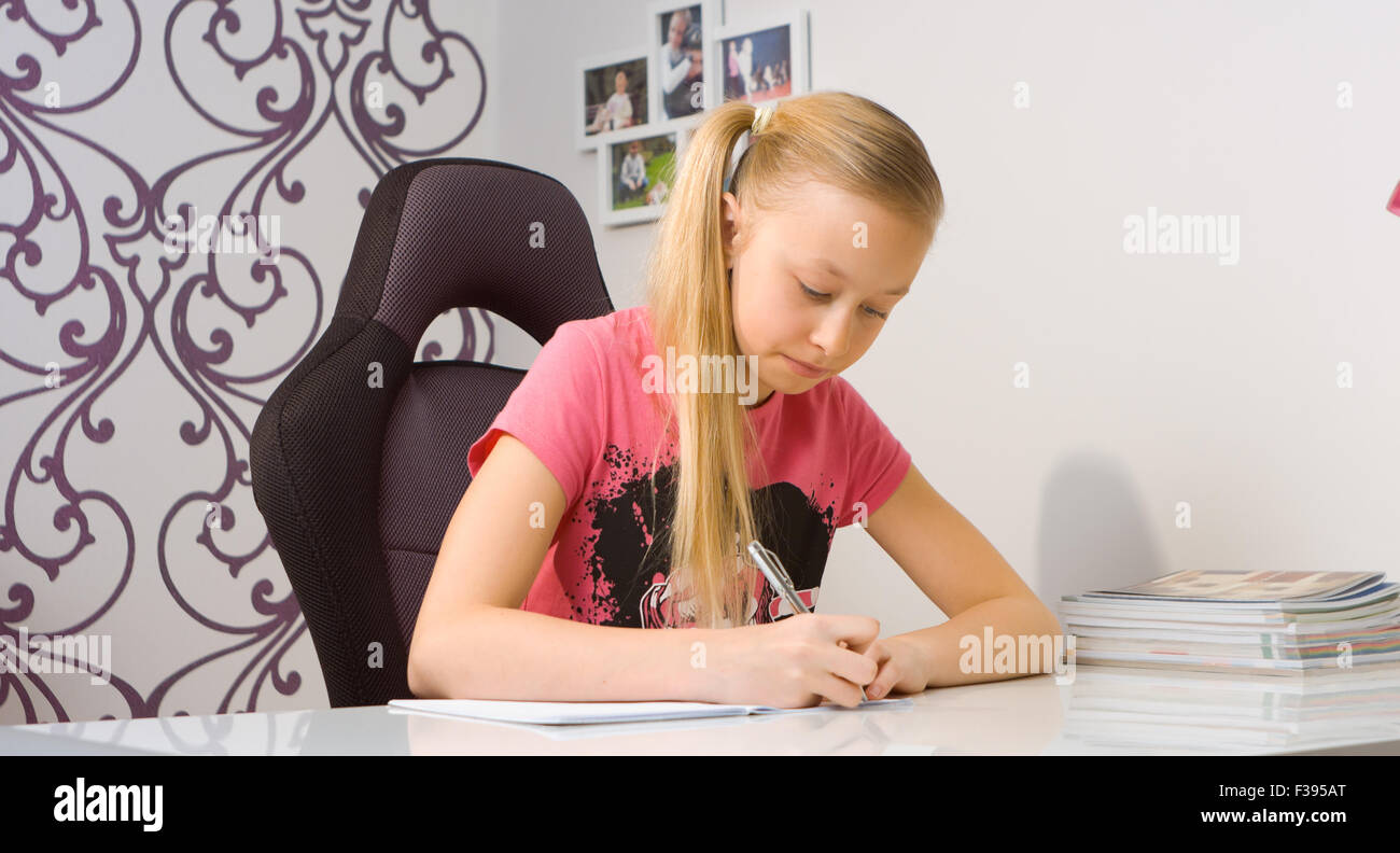 Girl doing homework Stock Photo - Alamy