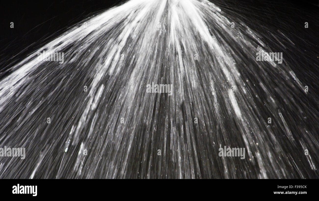 Sprinkler sprinkling water Stock Photo - Alamy