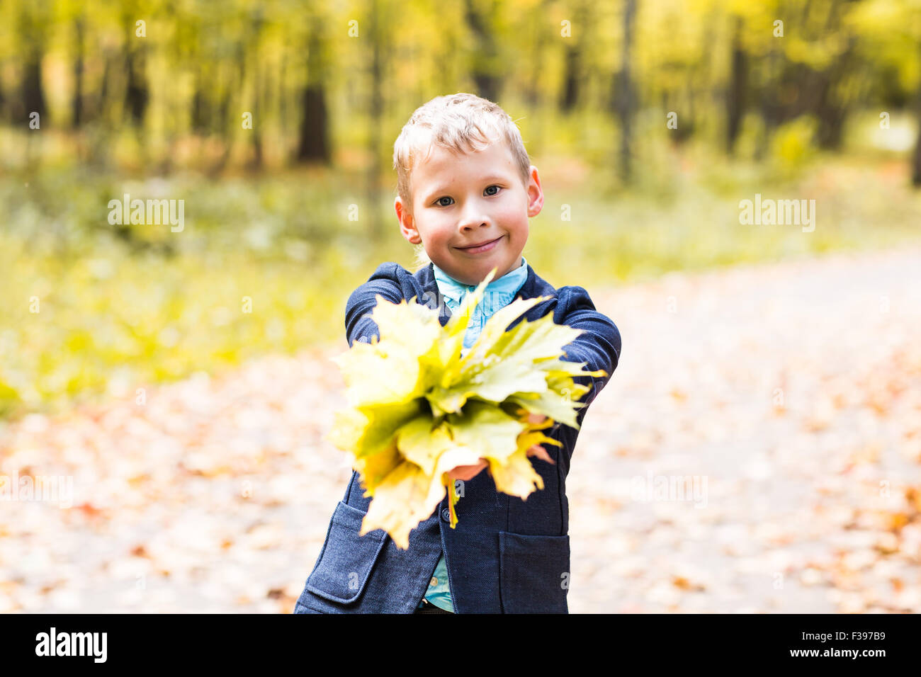 boy with autumn leaves Stock Photo - Alamy