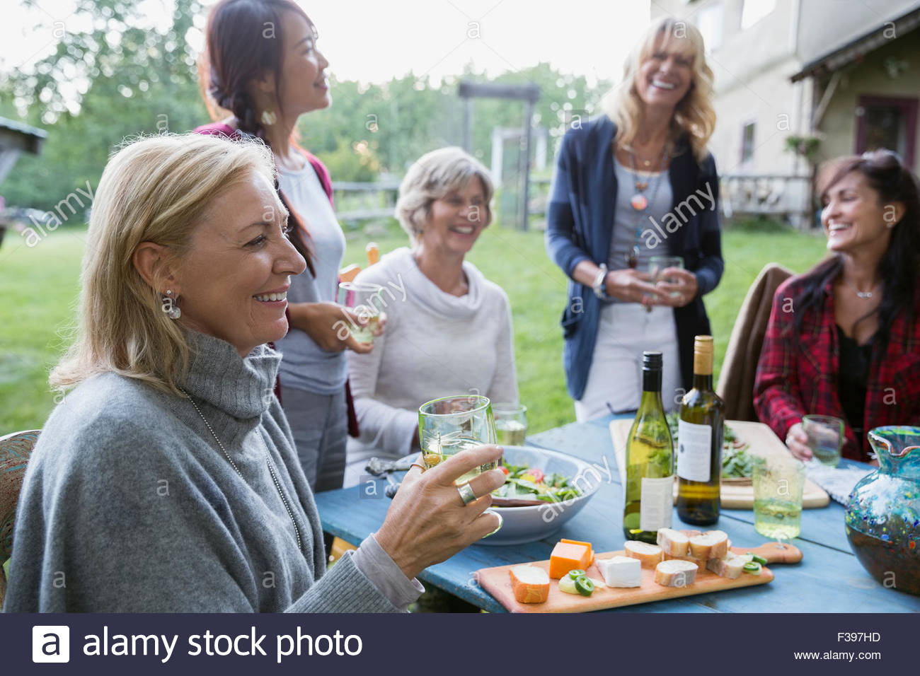 Woman standing happy party hi-res stock photography and images - Alamy