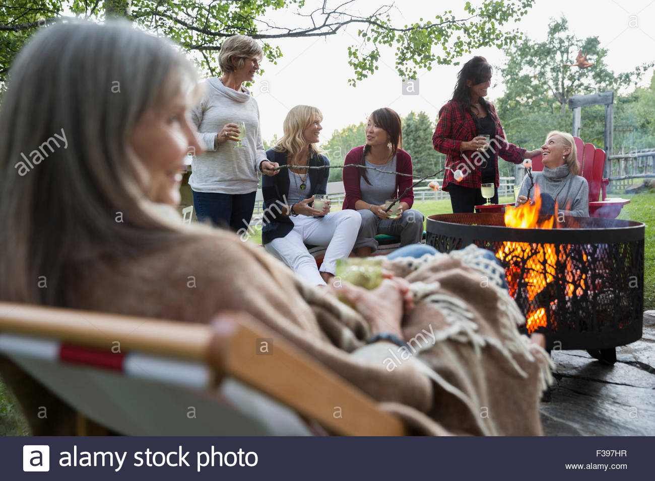 Sitting Around Fire Pit Stock Photos & Sitting Around Fire Pit Stock ...
