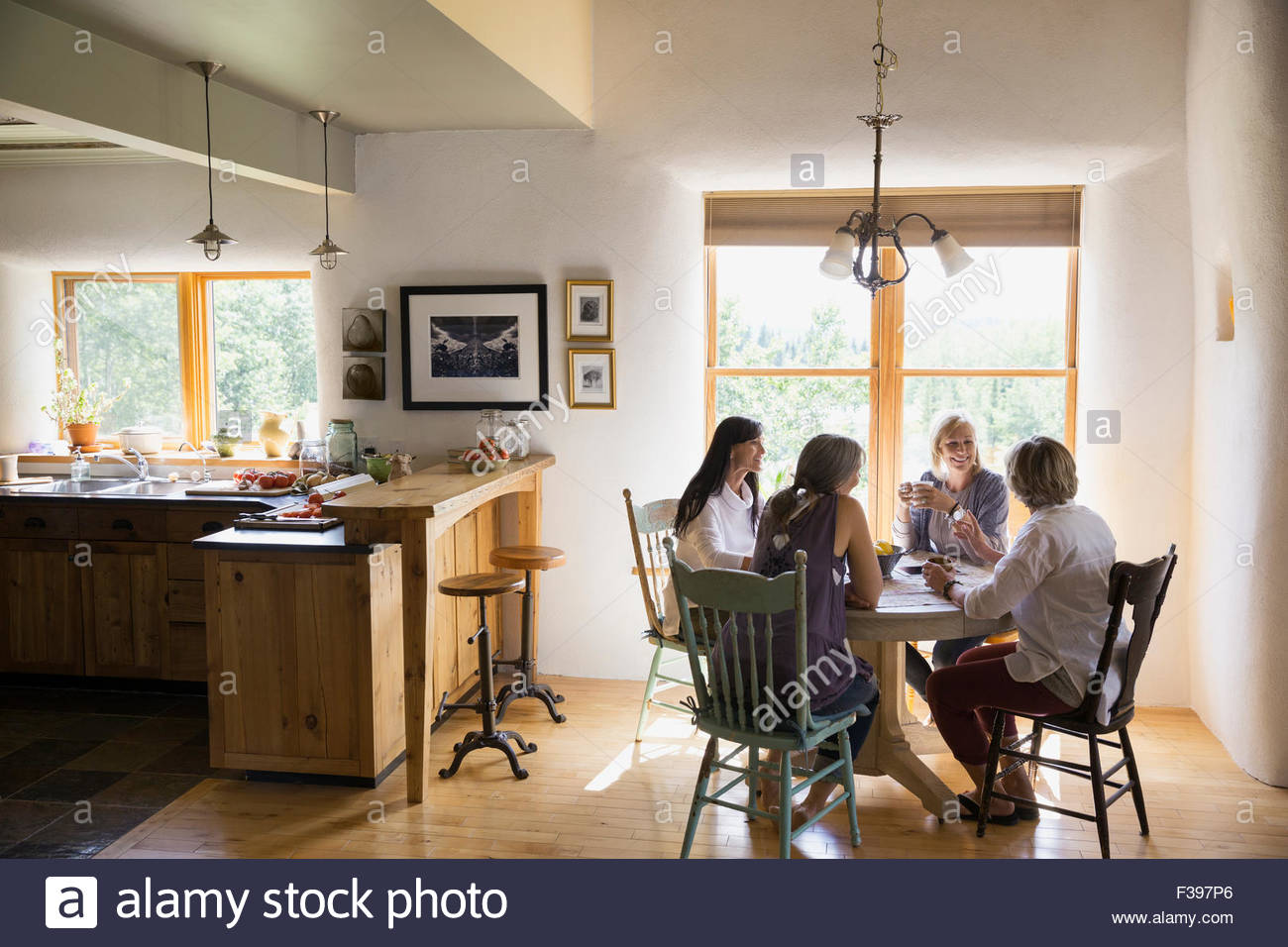 Man woman kitchen table talking hi-res stock photography and images - Alamy