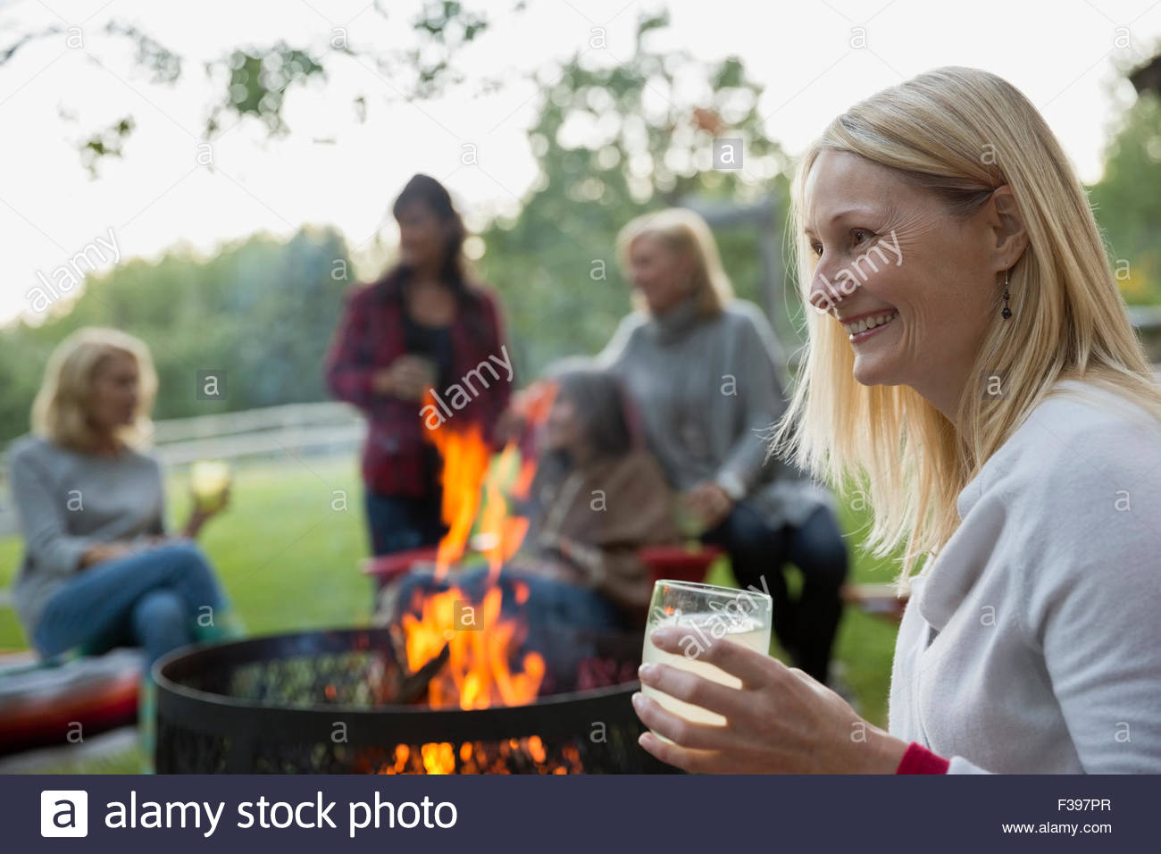 Woman at fire hi-res stock photography and images - Alamy