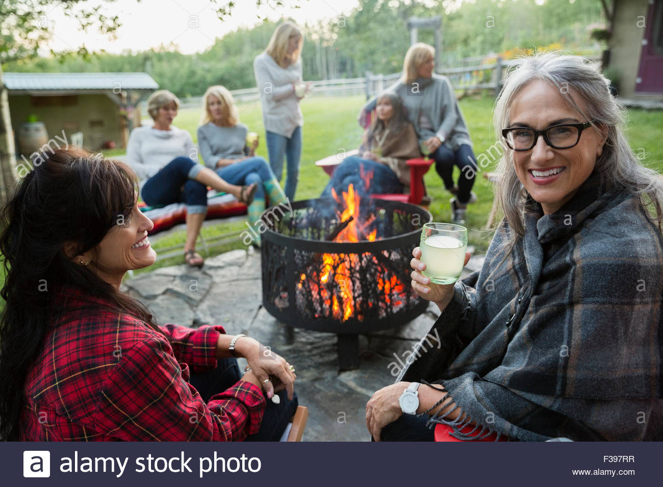 Backyard fire woman mature hi-res stock photography and images - Alamy
