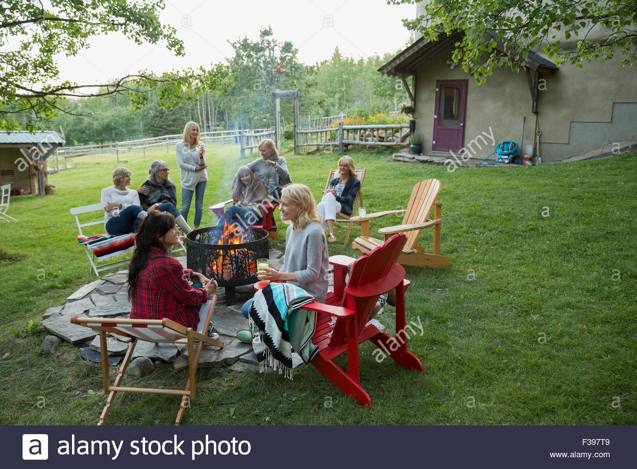 Sitting Around Fire Pit Stock Photos & Sitting Around Fire Pit Stock ...