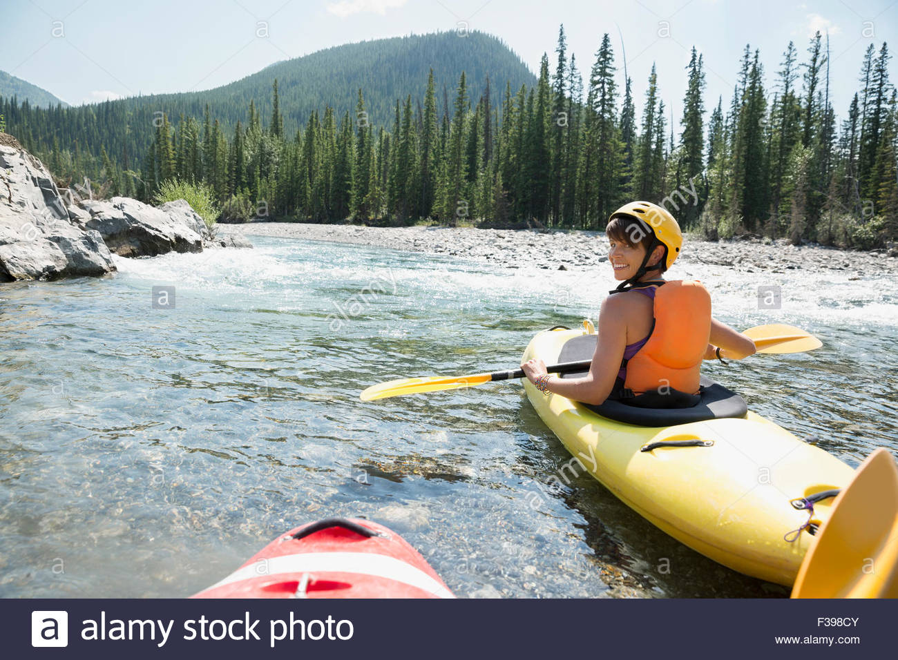 Portrait smiling woman kayaking in river Stock Photo - Alamy