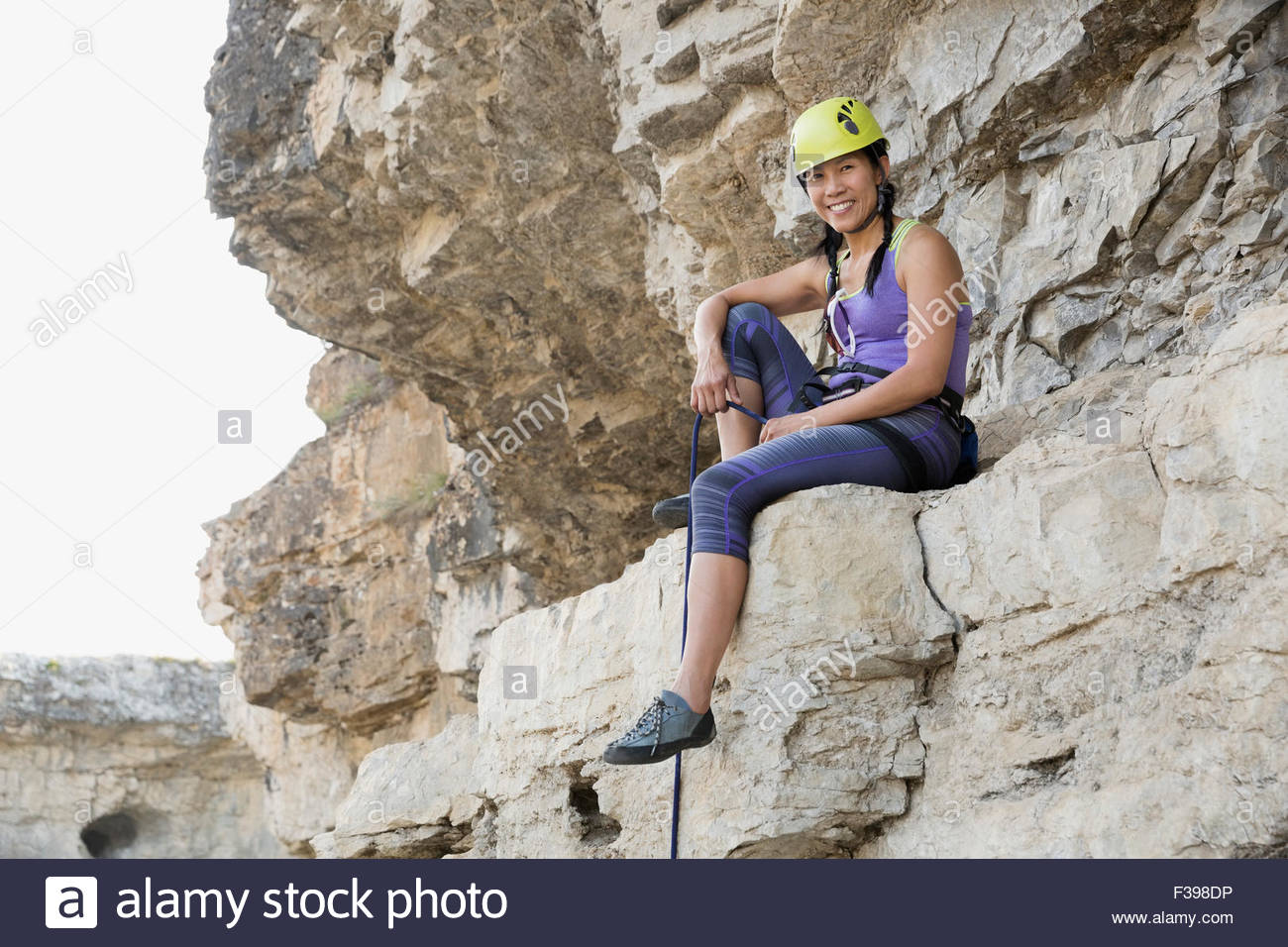 Women sitting on rock hi-res stock photography and images - Alamy