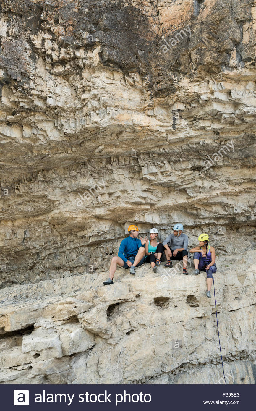 Young Woman Sitting On A Rock Stock Photos & Young Woman Sitting On A ...