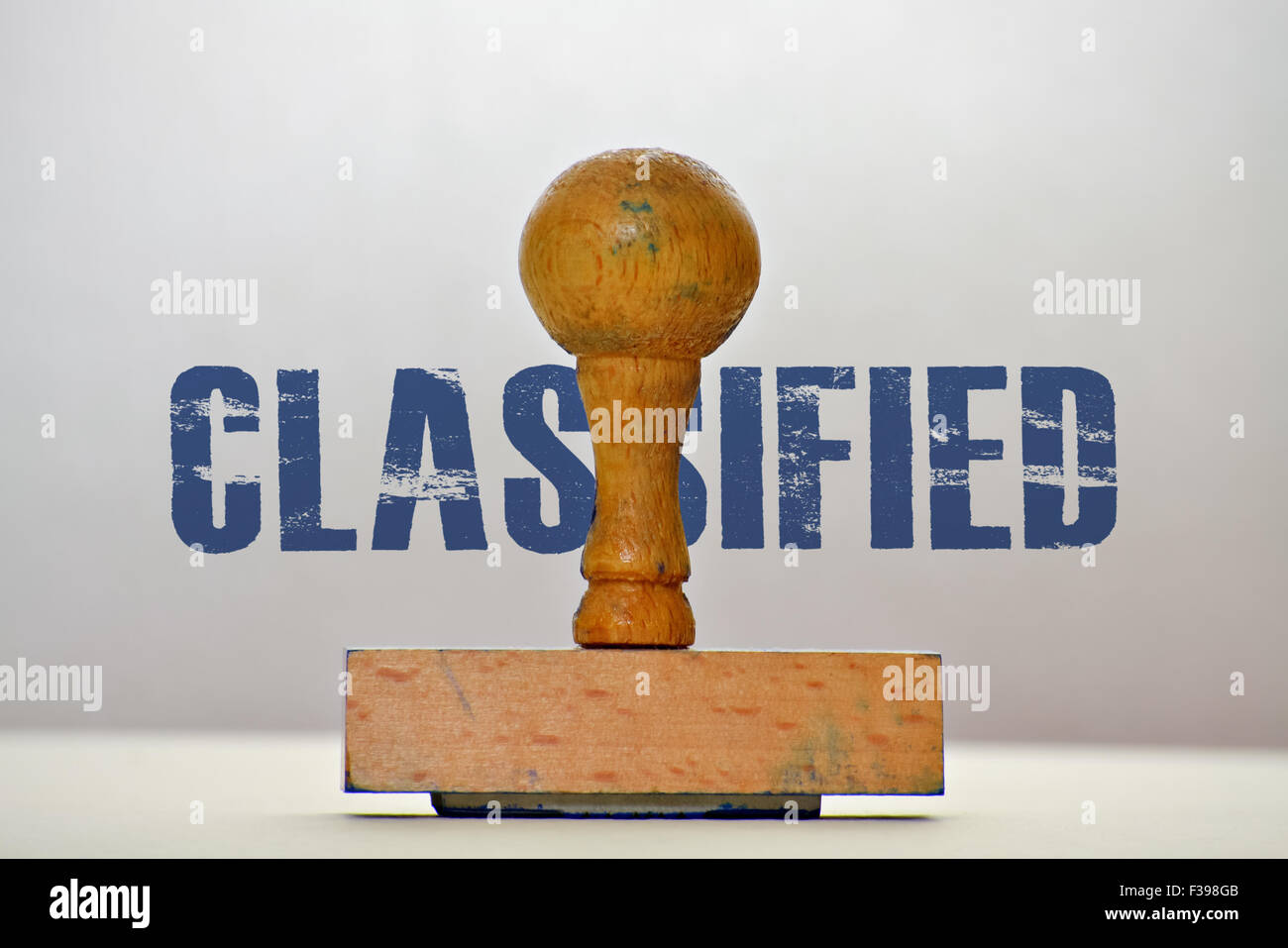 Rubber stamp and word Classified on bright background Stock Photo - Alamy