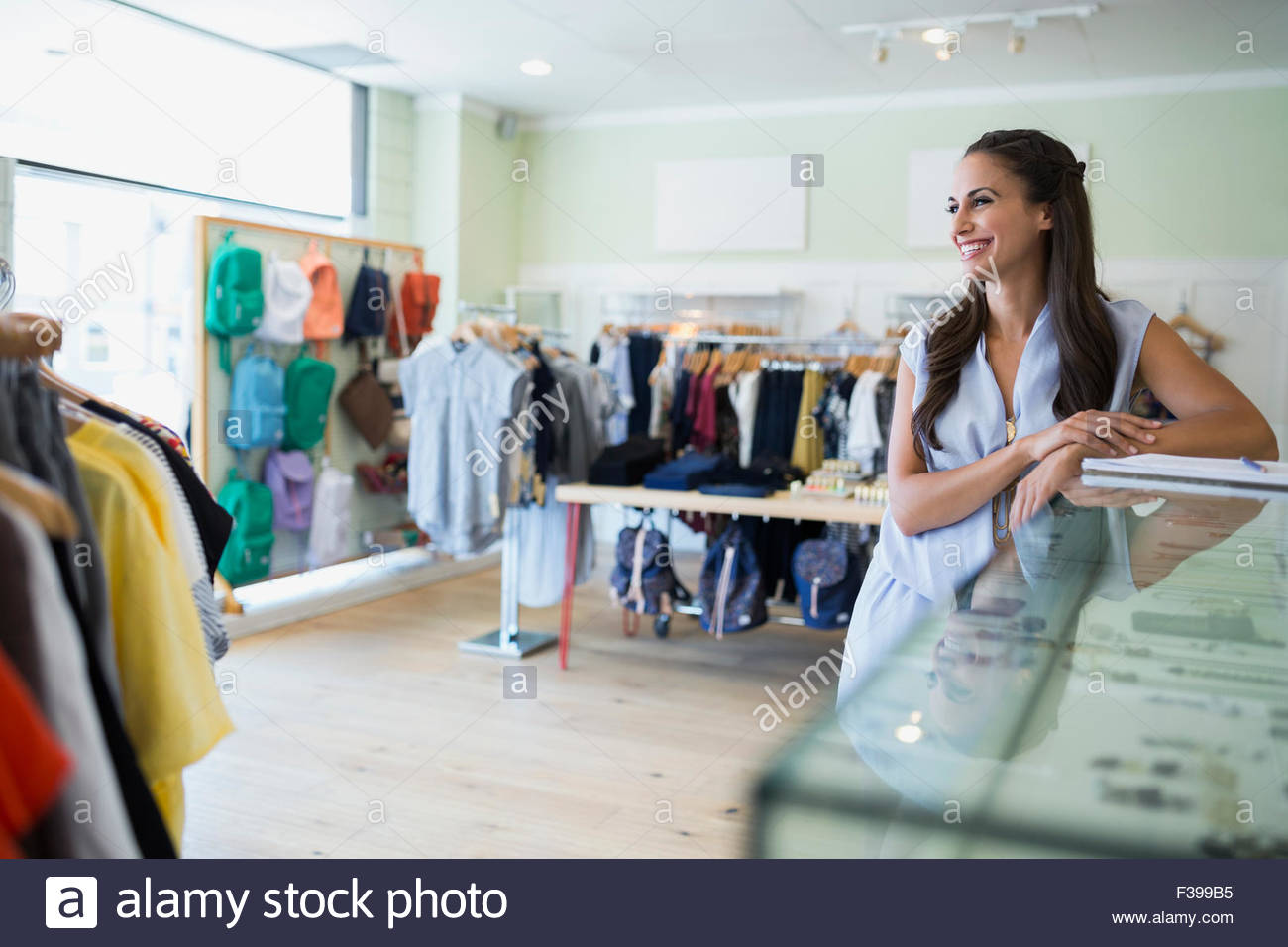 Smiling shopkeeper hi-res stock photography and images - Alamy