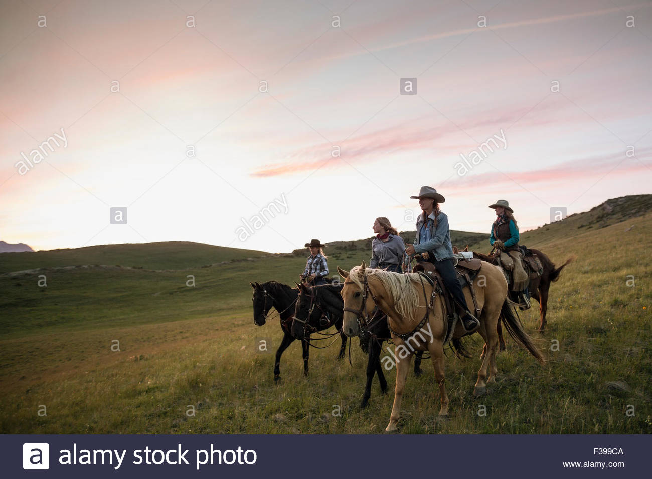Cowboy riding into sunset hi-res stock photography and images - Alamy