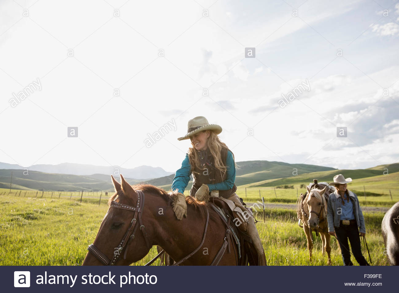 Mature woman riding horse hi-res stock photography and images - Alamy