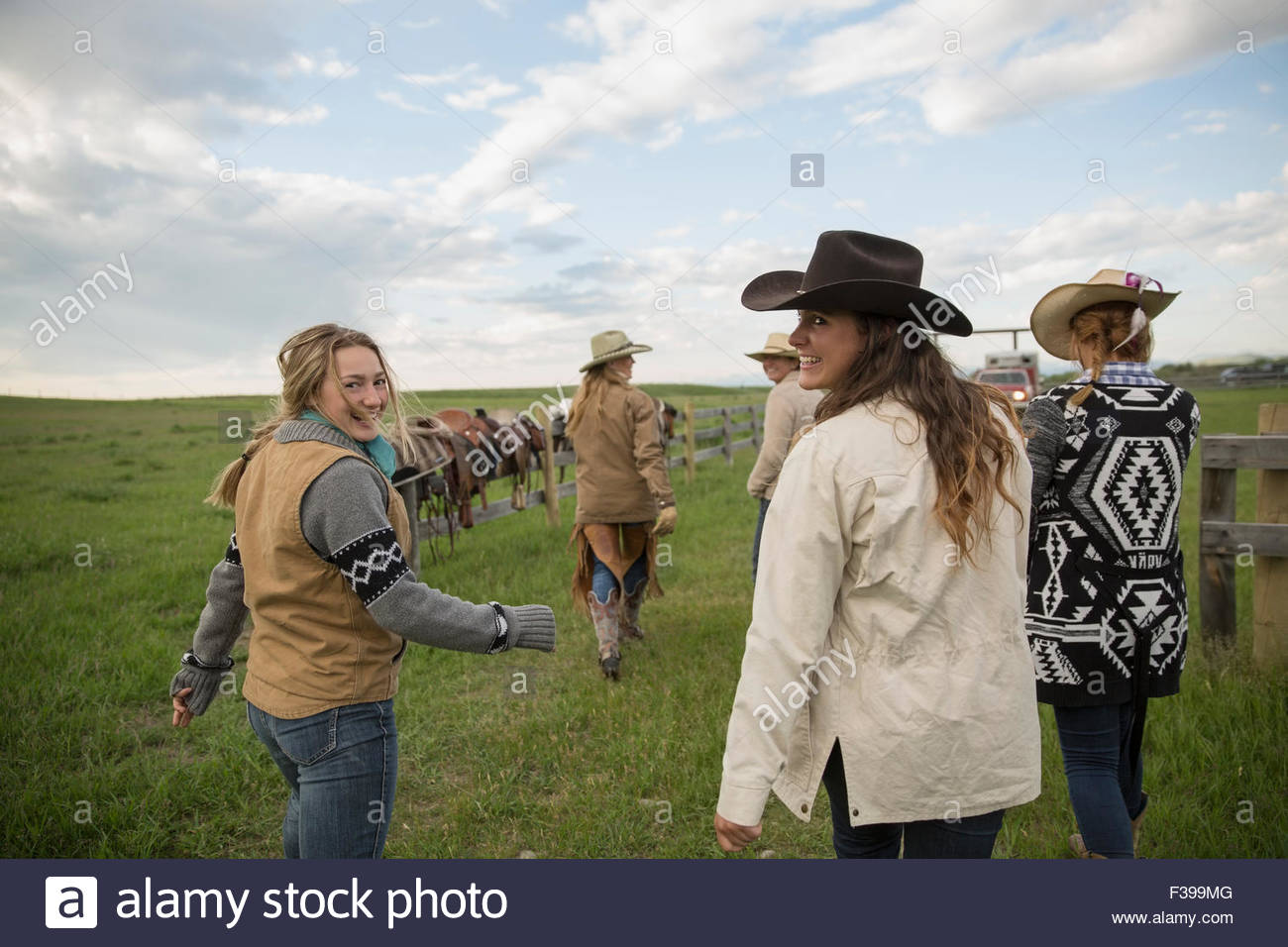Portrait female ranchers walking in rural pasture Stock Photo - Alamy