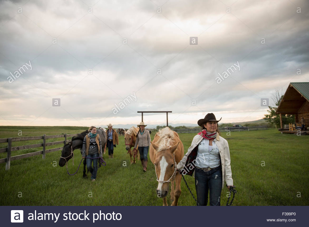 Female rancher walking horse in hi-res stock photography and images - Alamy