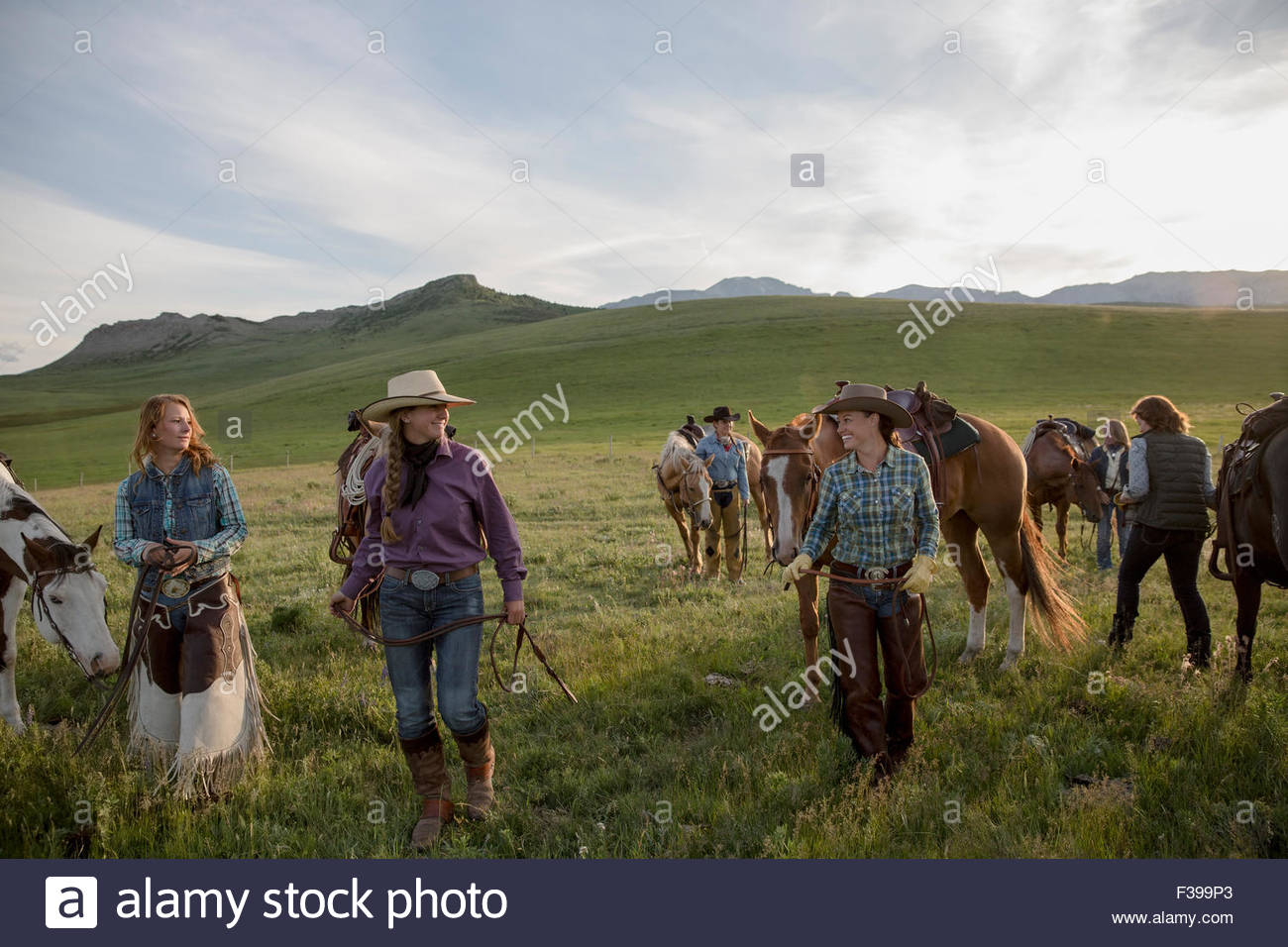 Female rancher walking horse in hi-res stock photography and images - Alamy