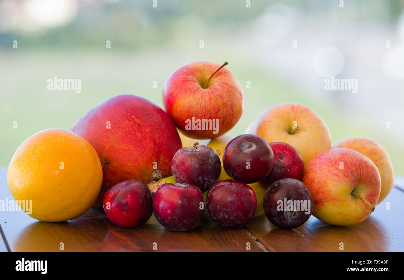 variety of fruits on table in the garden Stock Photo - Alamy