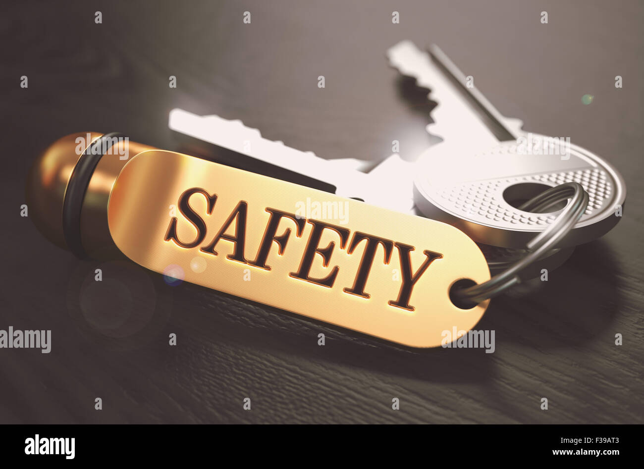 Keys to Safety - Concept on Golden Keychain over Black Wooden ...