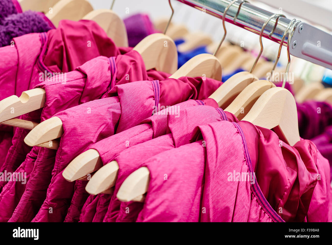 Clothes on Hangers in Shop Stock Photo - Alamy