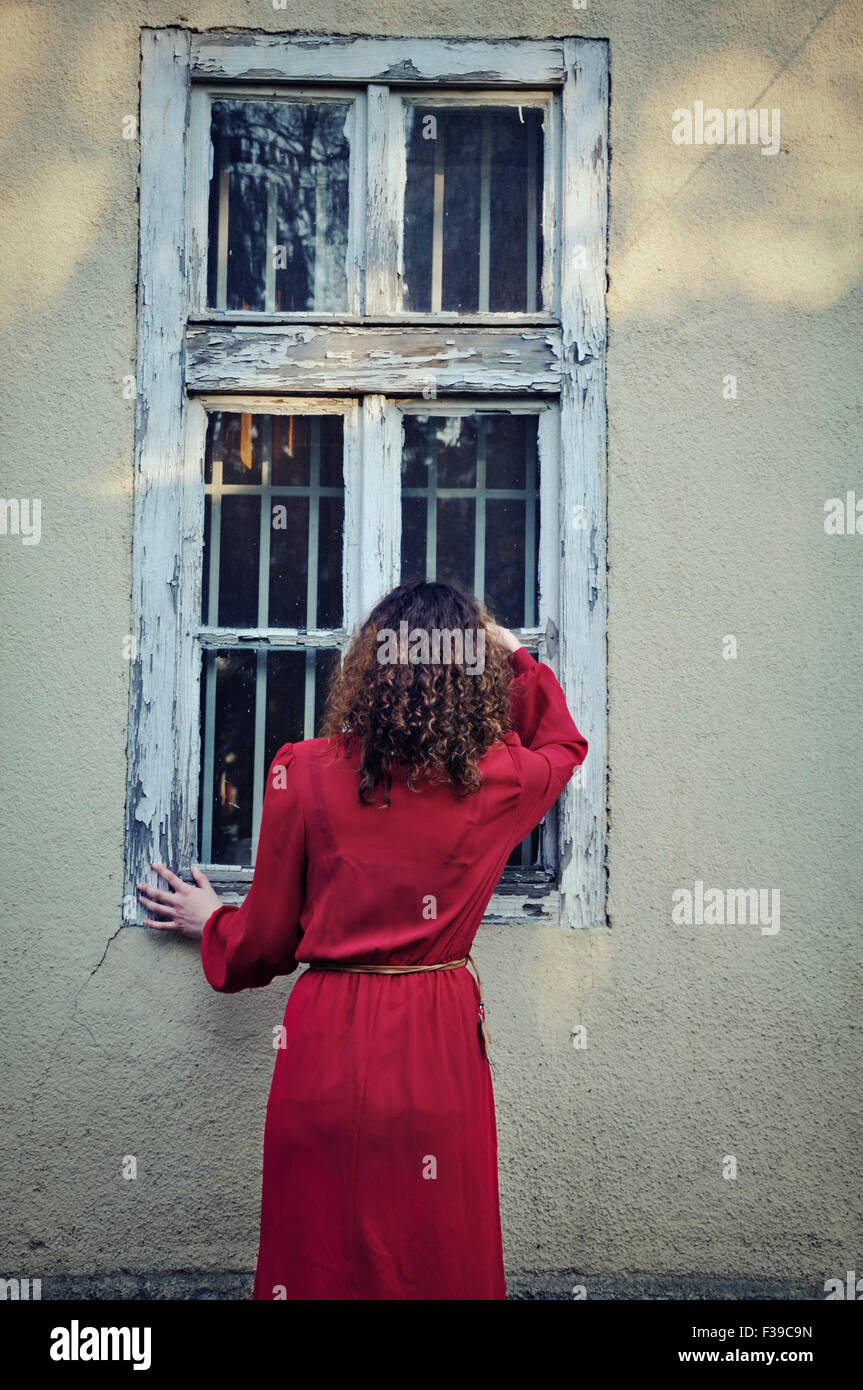 View of house through window woman hi-res stock photography and images ...
