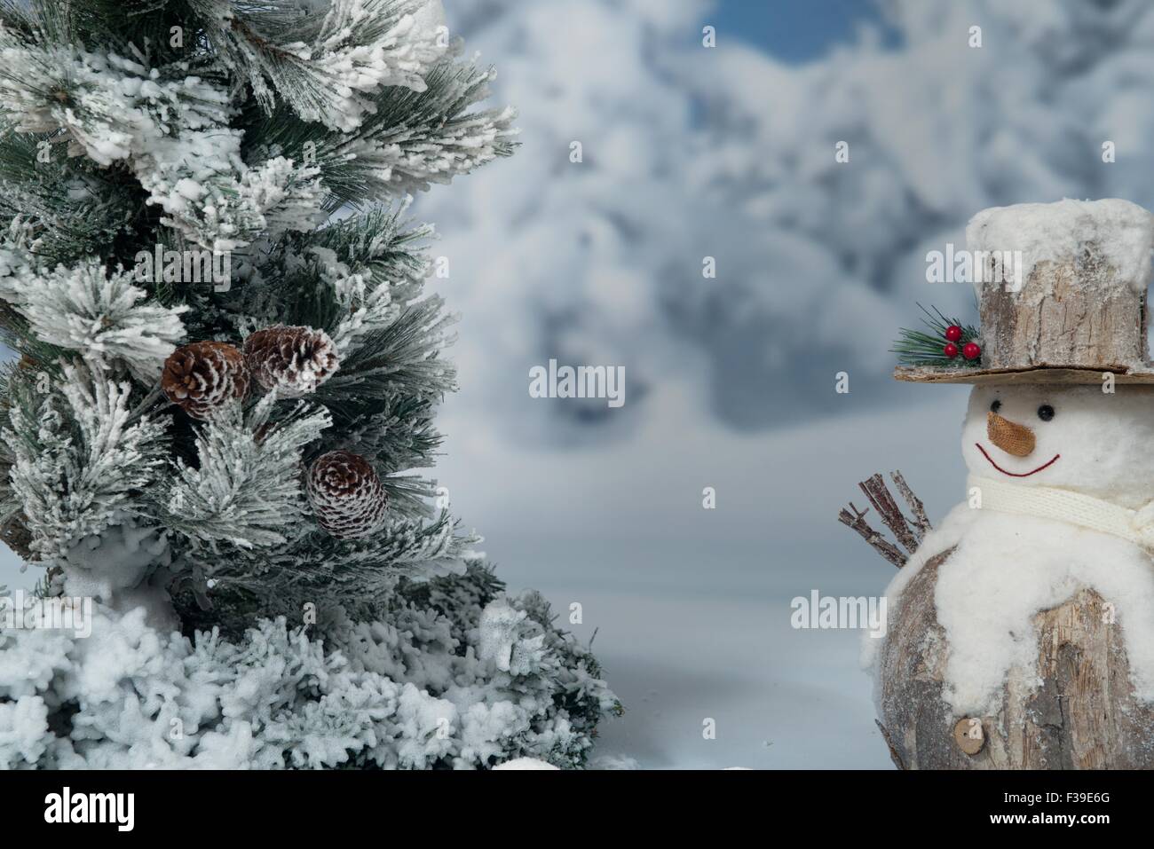 Snowman next to Christmas tree Stock Photo - Alamy