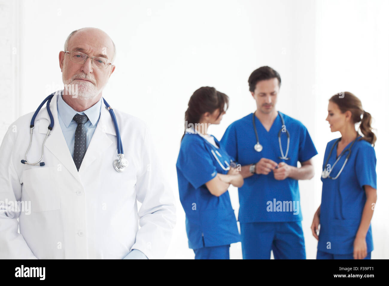 Professional team of doctors and nurses on white background Stock Photo ...