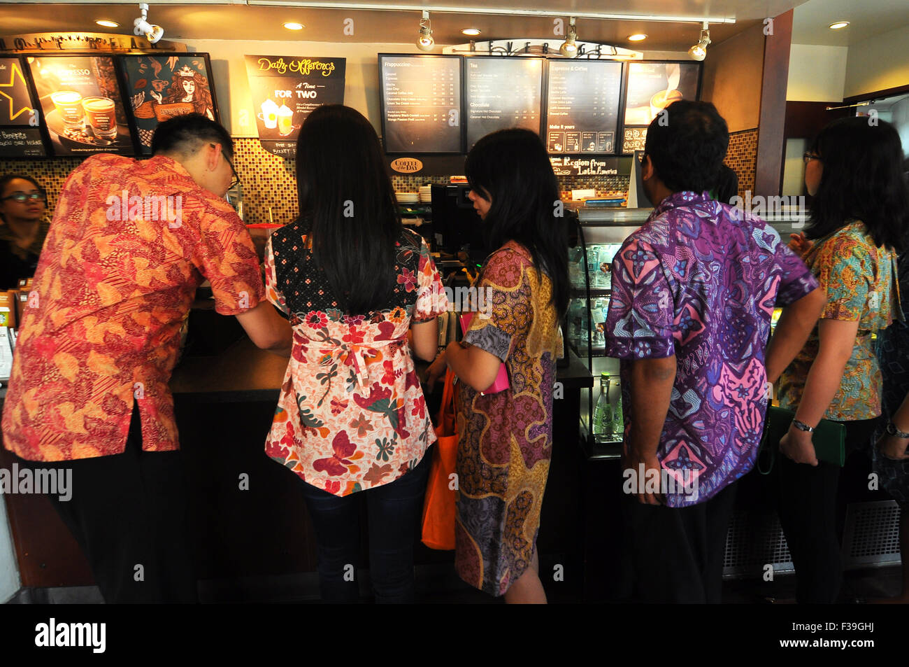 People wear "batik" during the National Batik Day in Indonesia. In 2009 ...