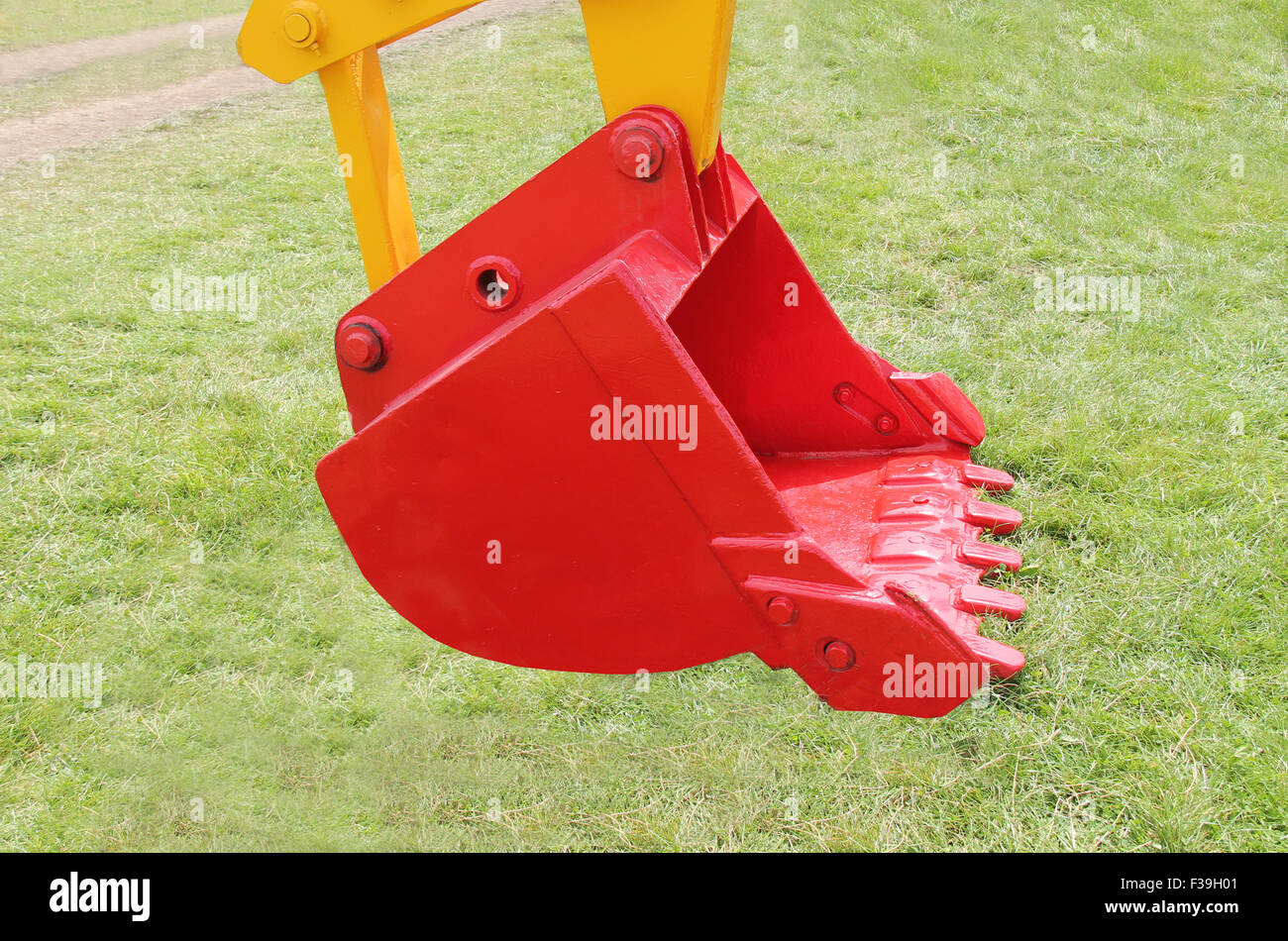 A Bright Red Bucket of a New Digger Excavator Stock Photo - Alamy