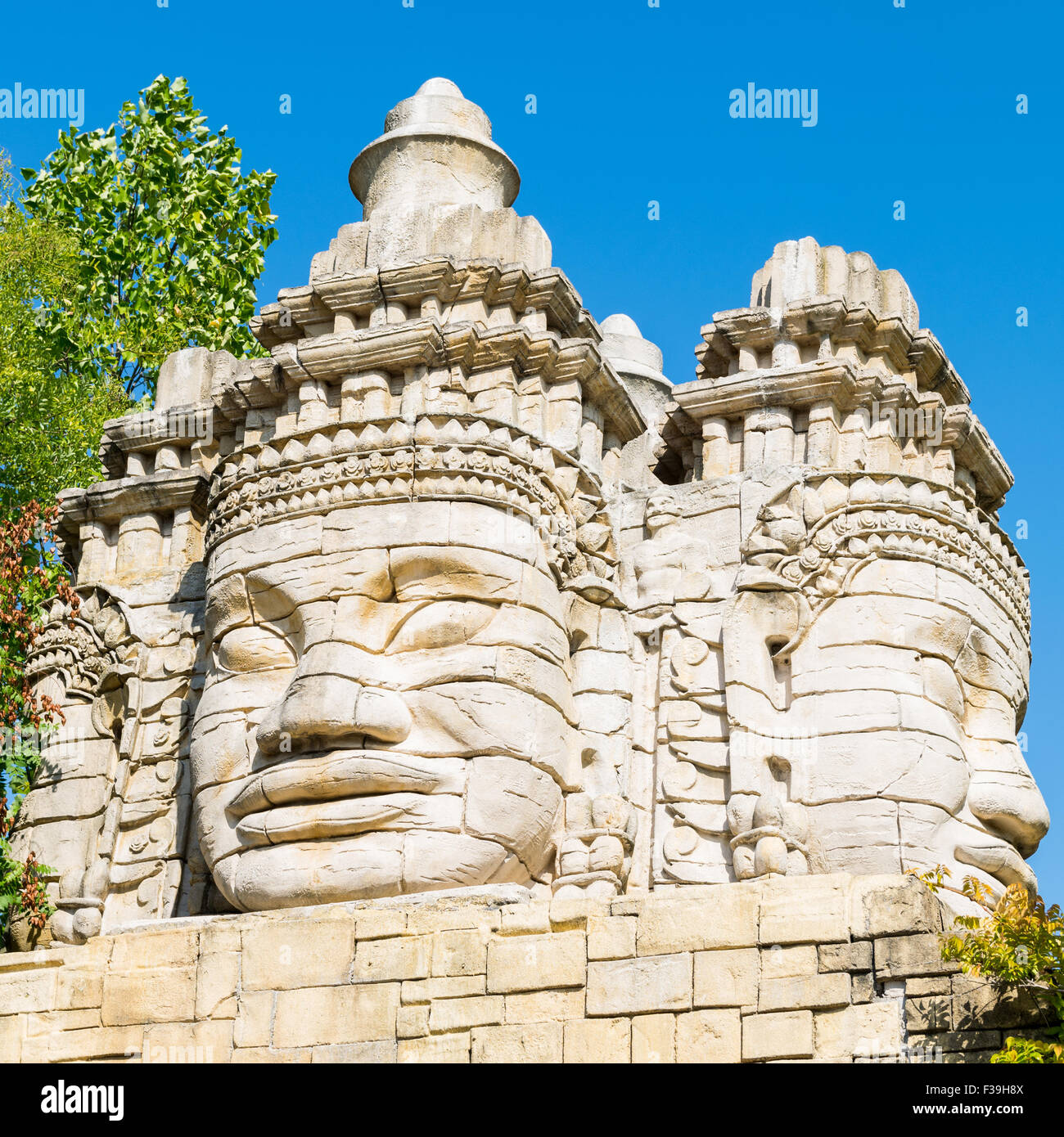 Stone faces of a temple in the forest Stock Photo - Alamy