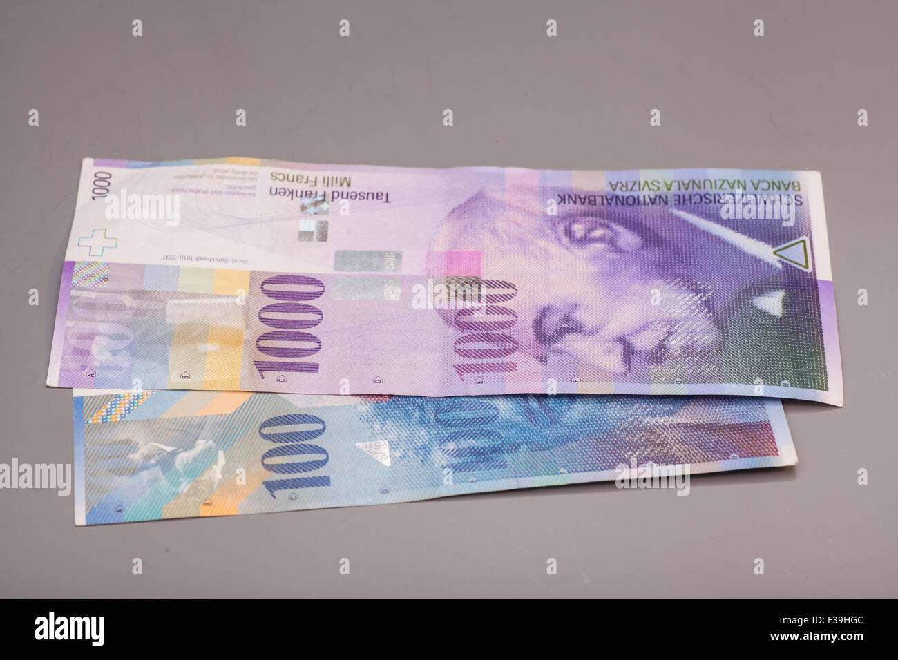 Swiss francs, currency of Switzerland isolated on gray Stock Photo - Alamy