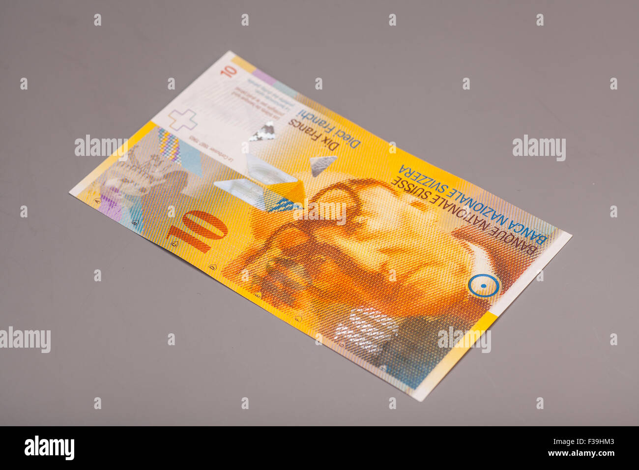 10 Swiss francs, currency of Switzerland isolated on gray Stock Photo ...