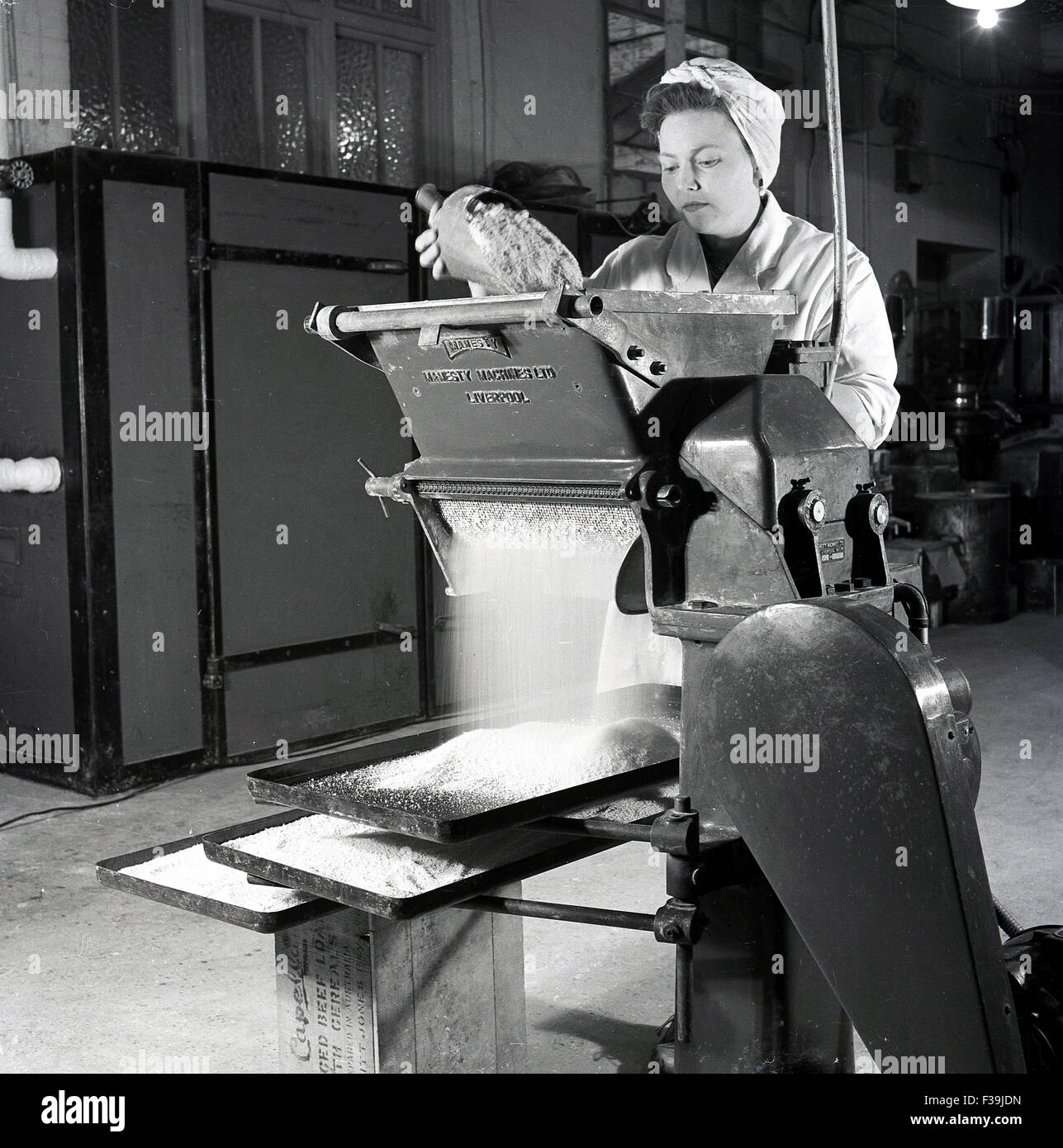 1950s, historical, female factory operative at work making medicines at ...